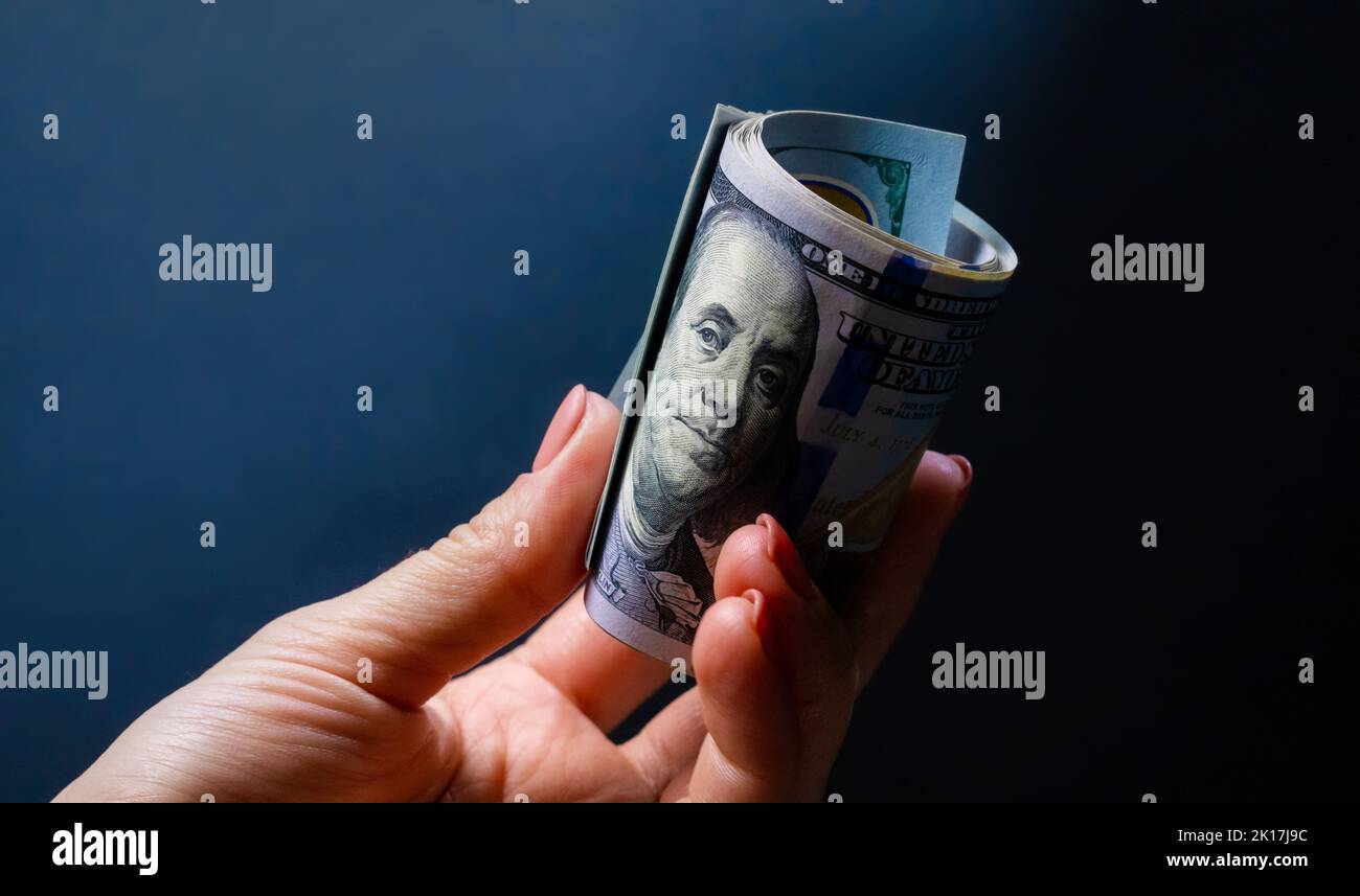 Hand holding banknotes Stock Photo - Alamy