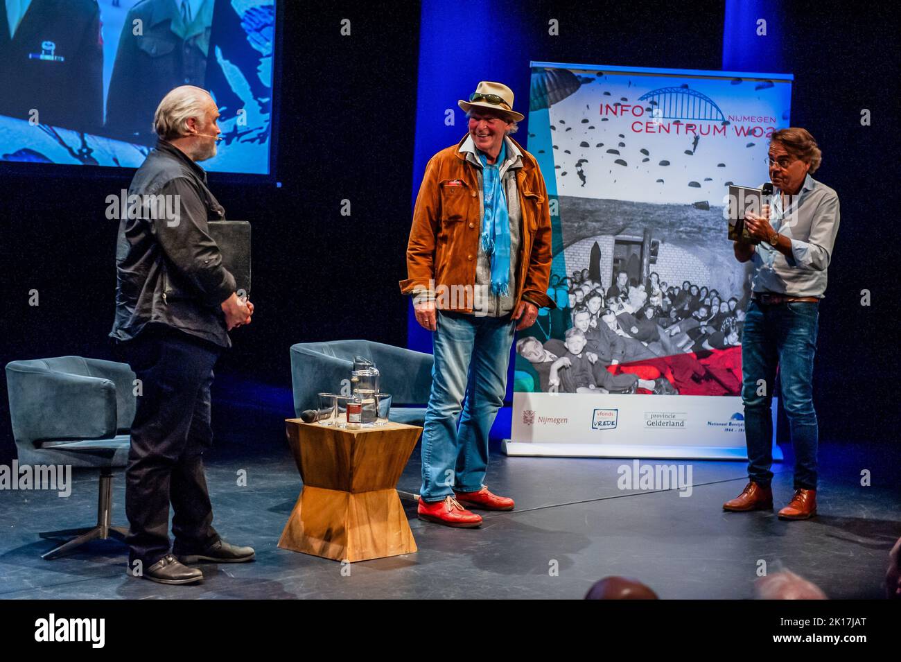Dutch actor, Peter Faber (C) seen receiving a book about the movie from ...