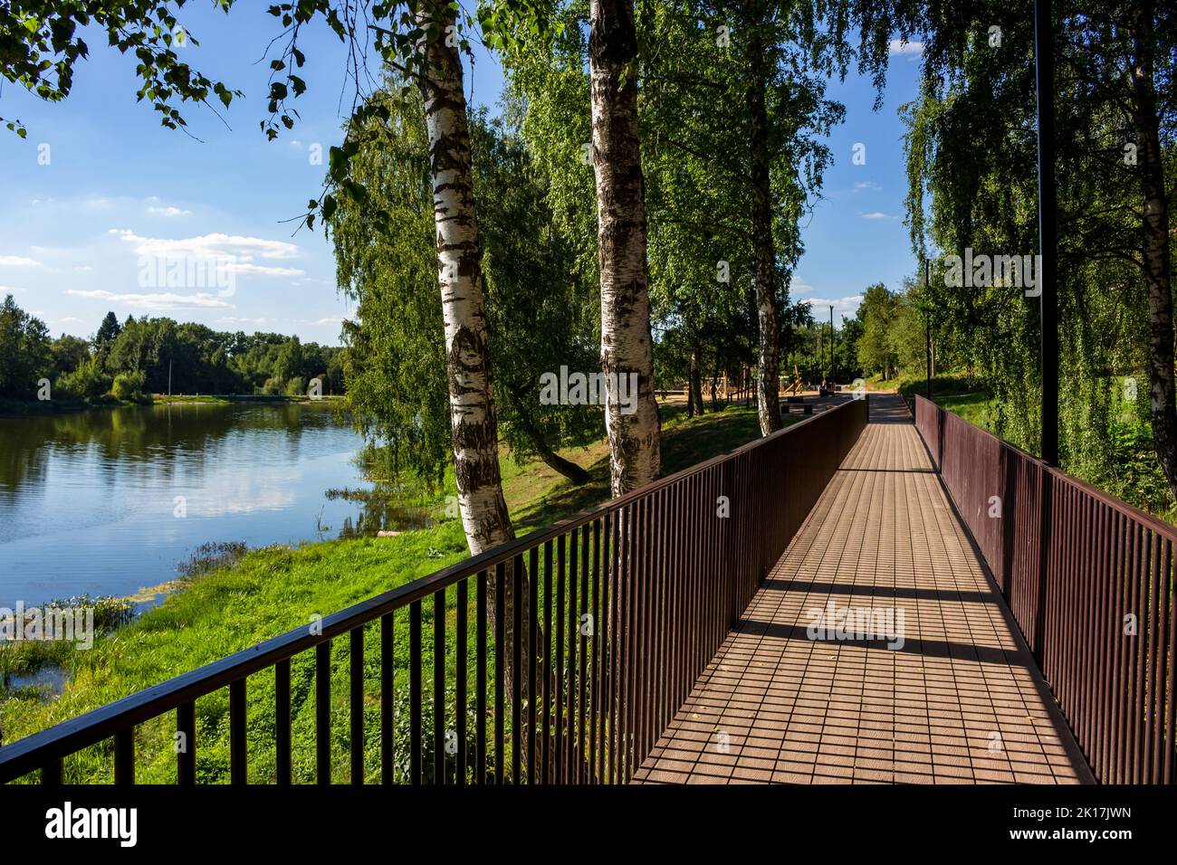 A beautiful promenade overlooking the lake, wooden walkways with ...