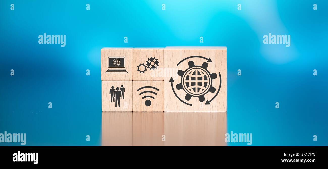 Wooden blocks with symbol of globalization concept on blue background ...