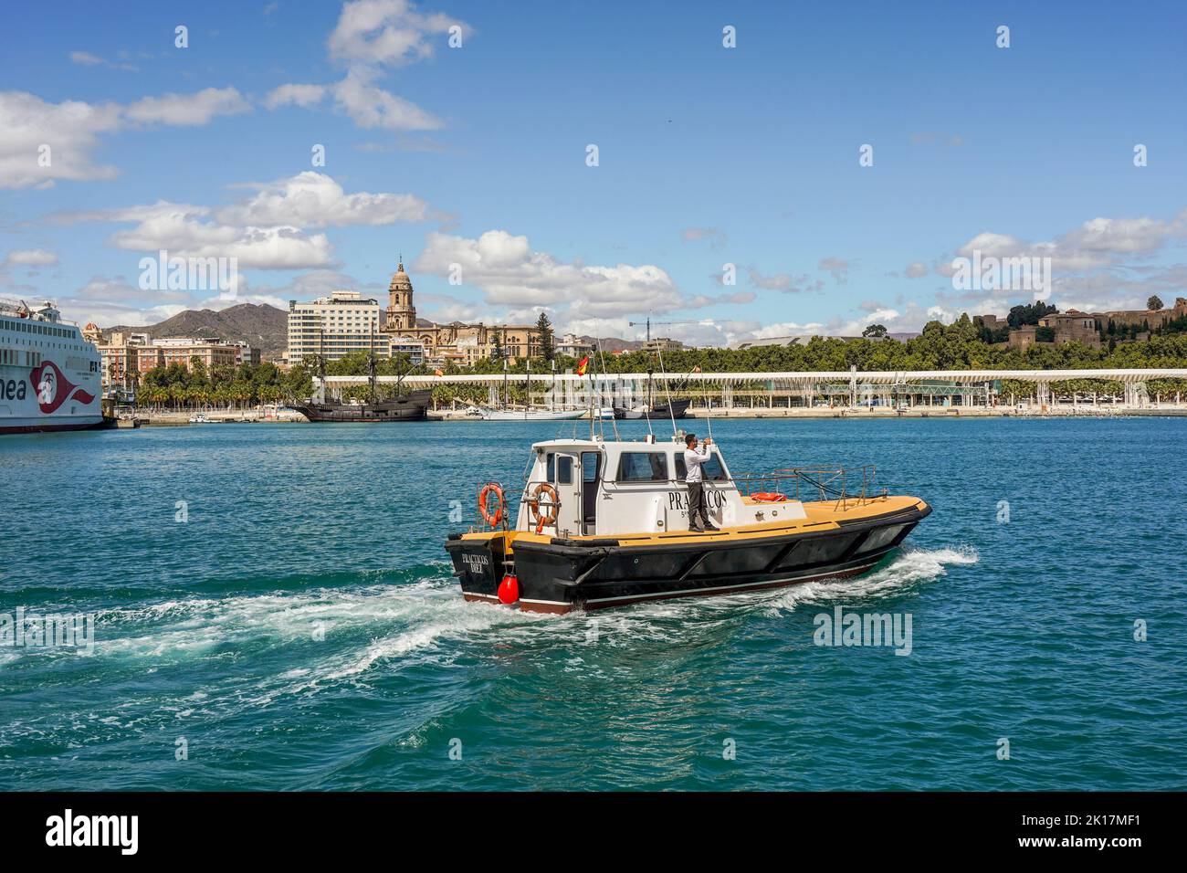 Small boat entering port of malaga hi-res stock photography and images ...
