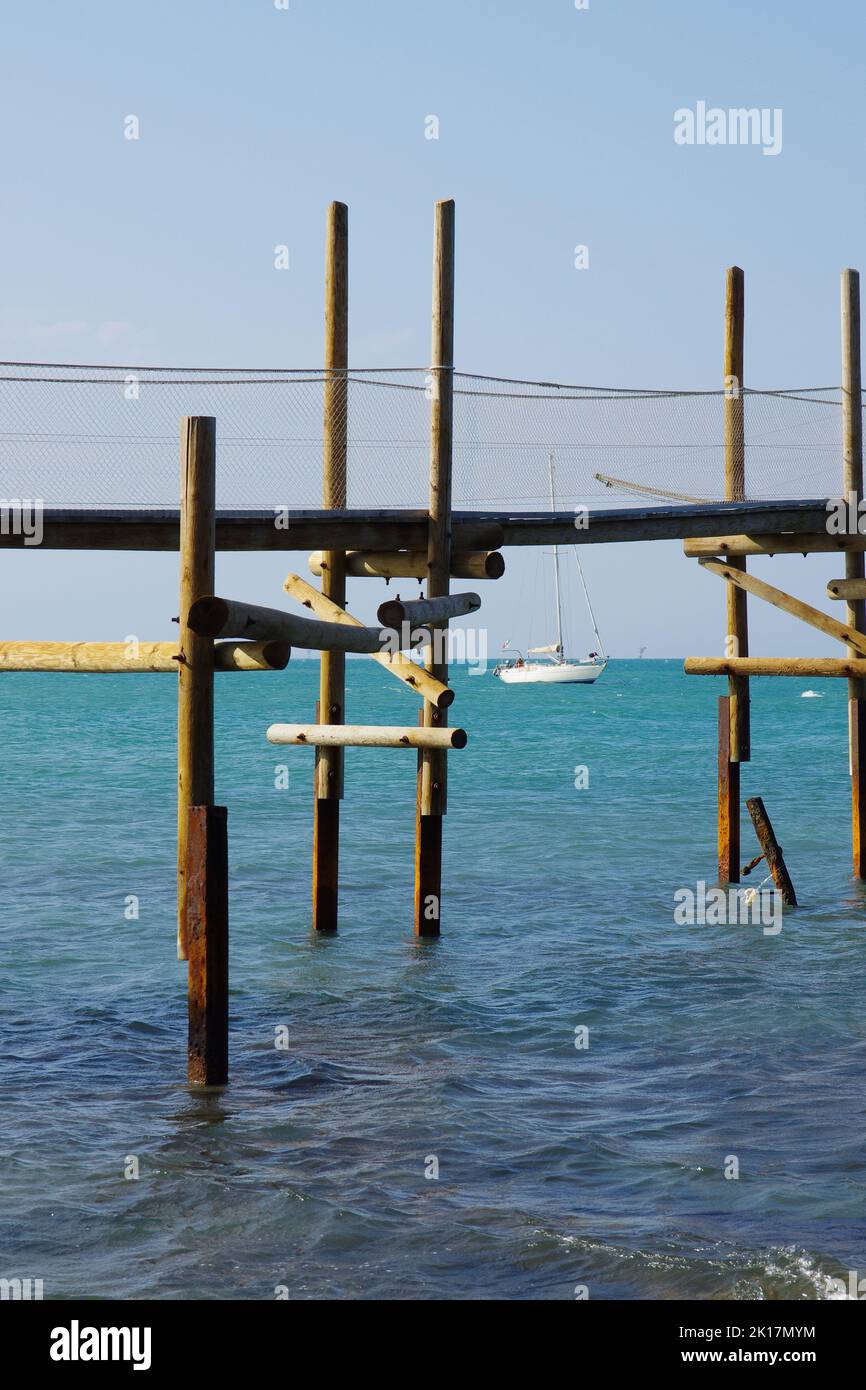 Part of a trebuchet, an ancient fishing machine, are used to catch fish ...