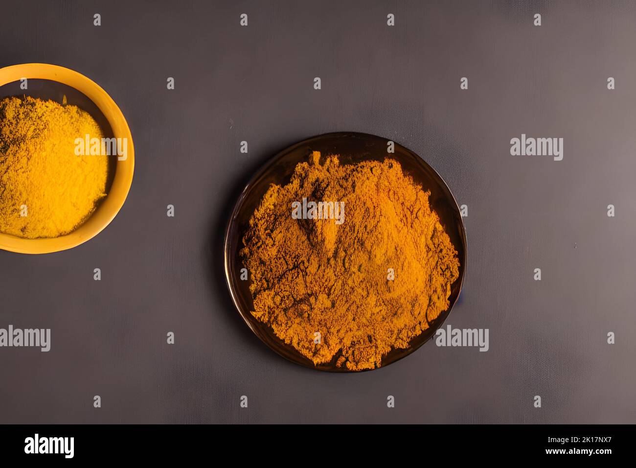 A top view of bowls of turmeric and curry powders on gray surface with ...