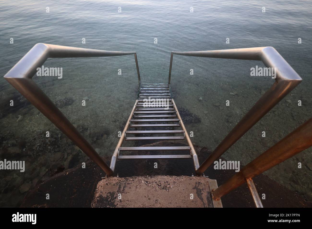 Metal stairs to the entrance of the sea Stock Photo - Alamy