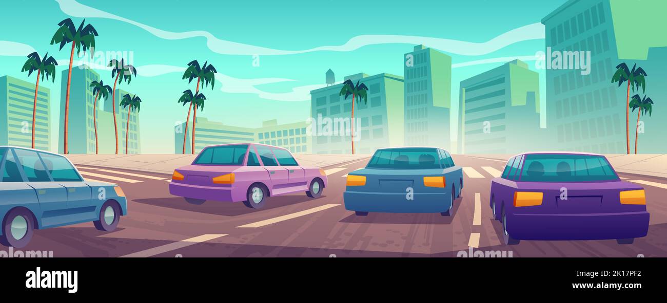 Cars drive on road on city street with sidewalk, buildings and palm ...
