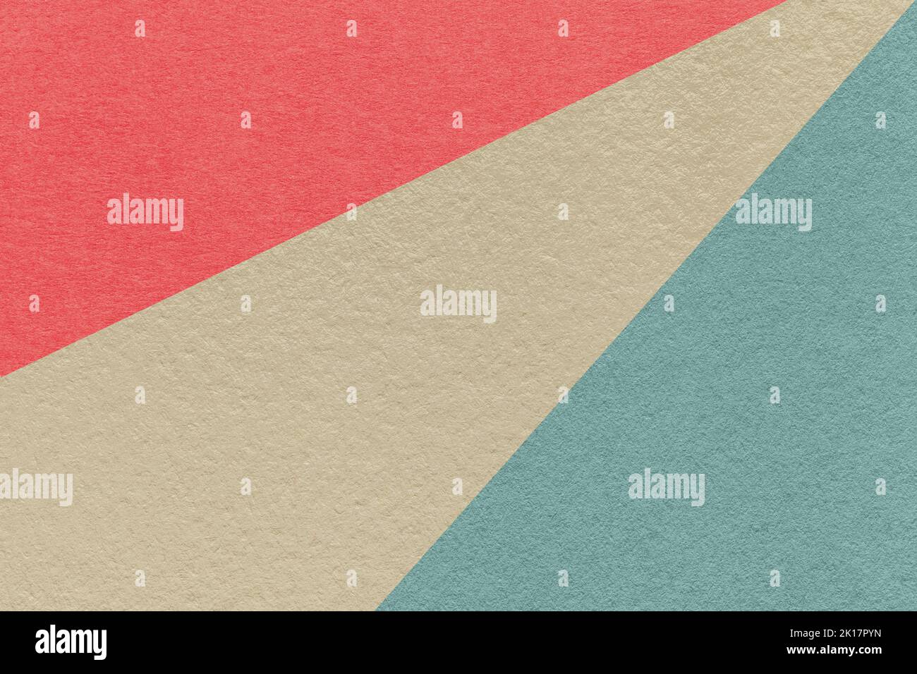 Texture of old craft red, beige and blue color paper background, macro ...