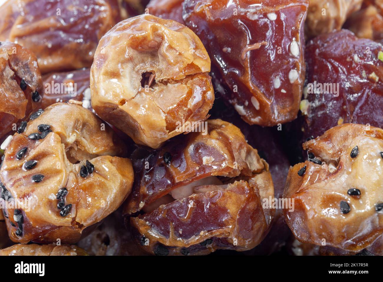 Traditional Arabic Sukari dates close up with nuts and arab herbs full ...