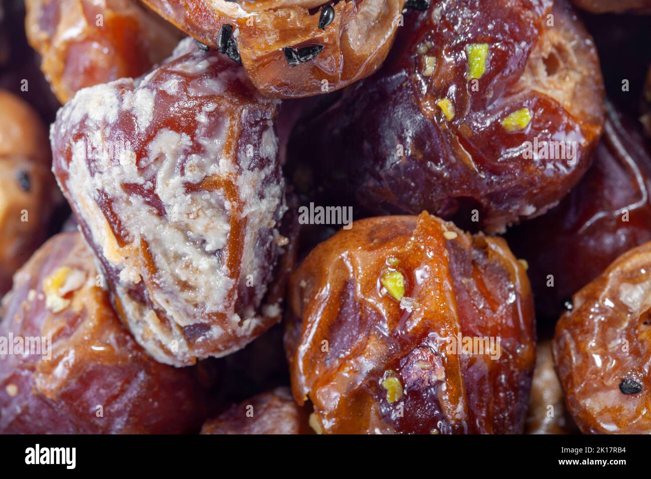 Traditional Arabic Sukari dates close up with nuts and arab herbs full ...