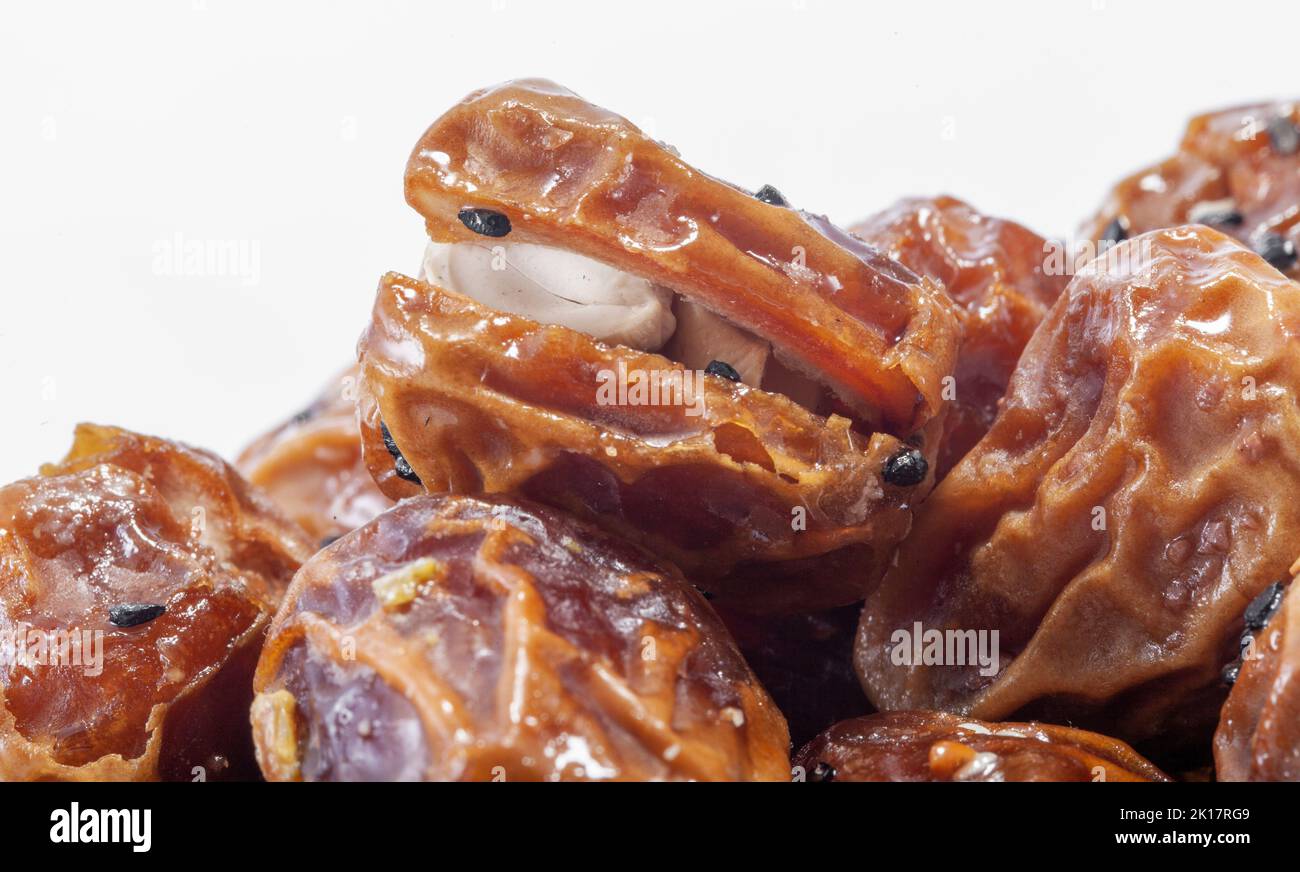 Traditional Arabic Sukari dates close up with nuts and arab herbs full ...