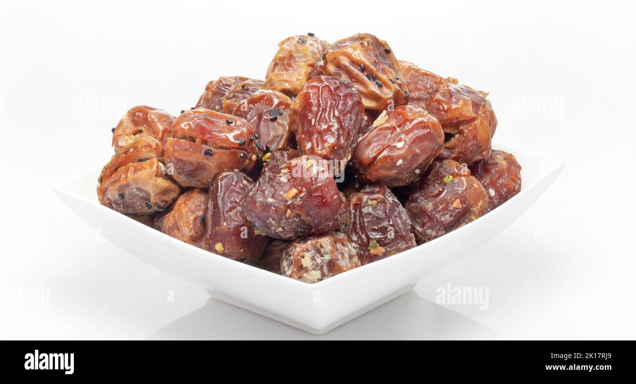 Traditional Arabic Sukari dates close up with nuts and arab herbs full ...
