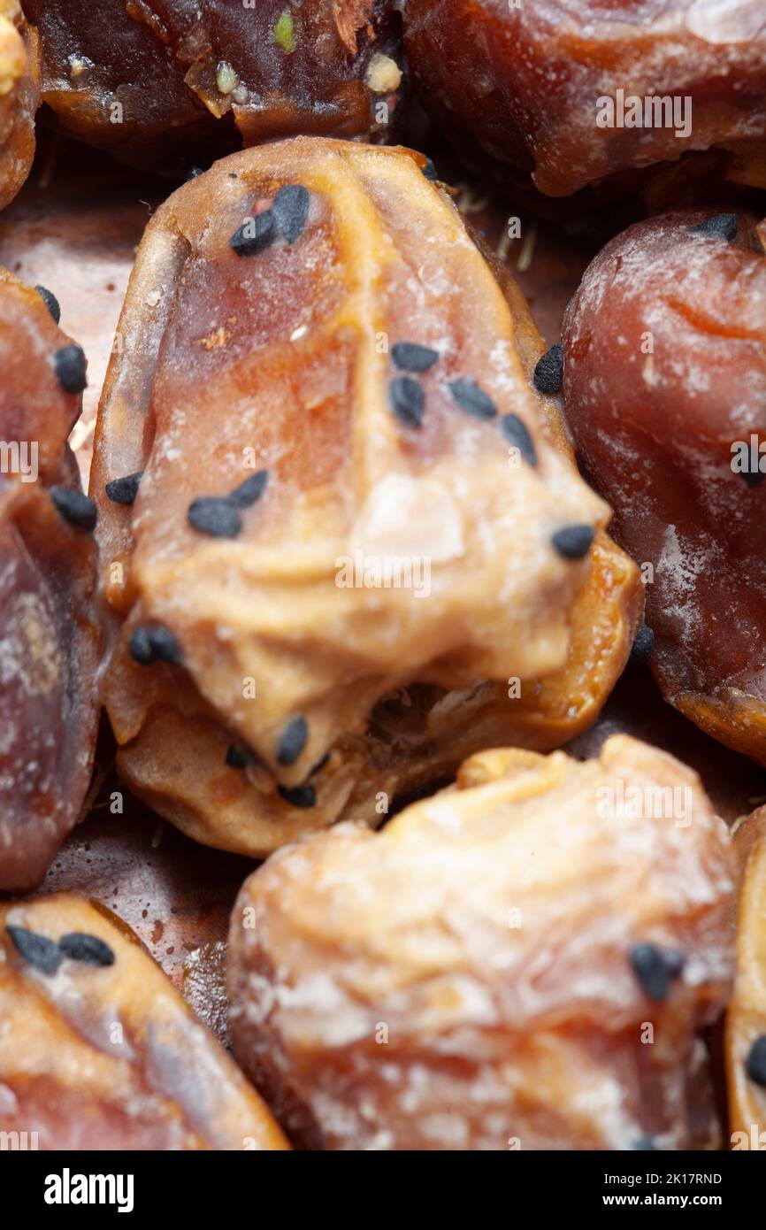 Traditional Arabic Sukari dates close up with nuts and arab herbs full ...