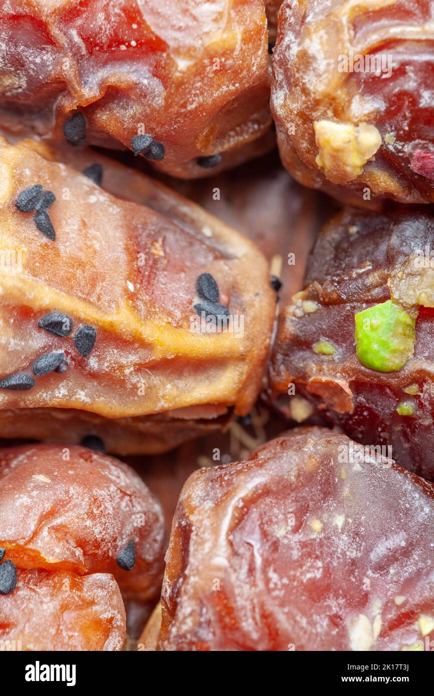 Traditional Arabic Sukari dates close up with nuts and arab herbs full ...