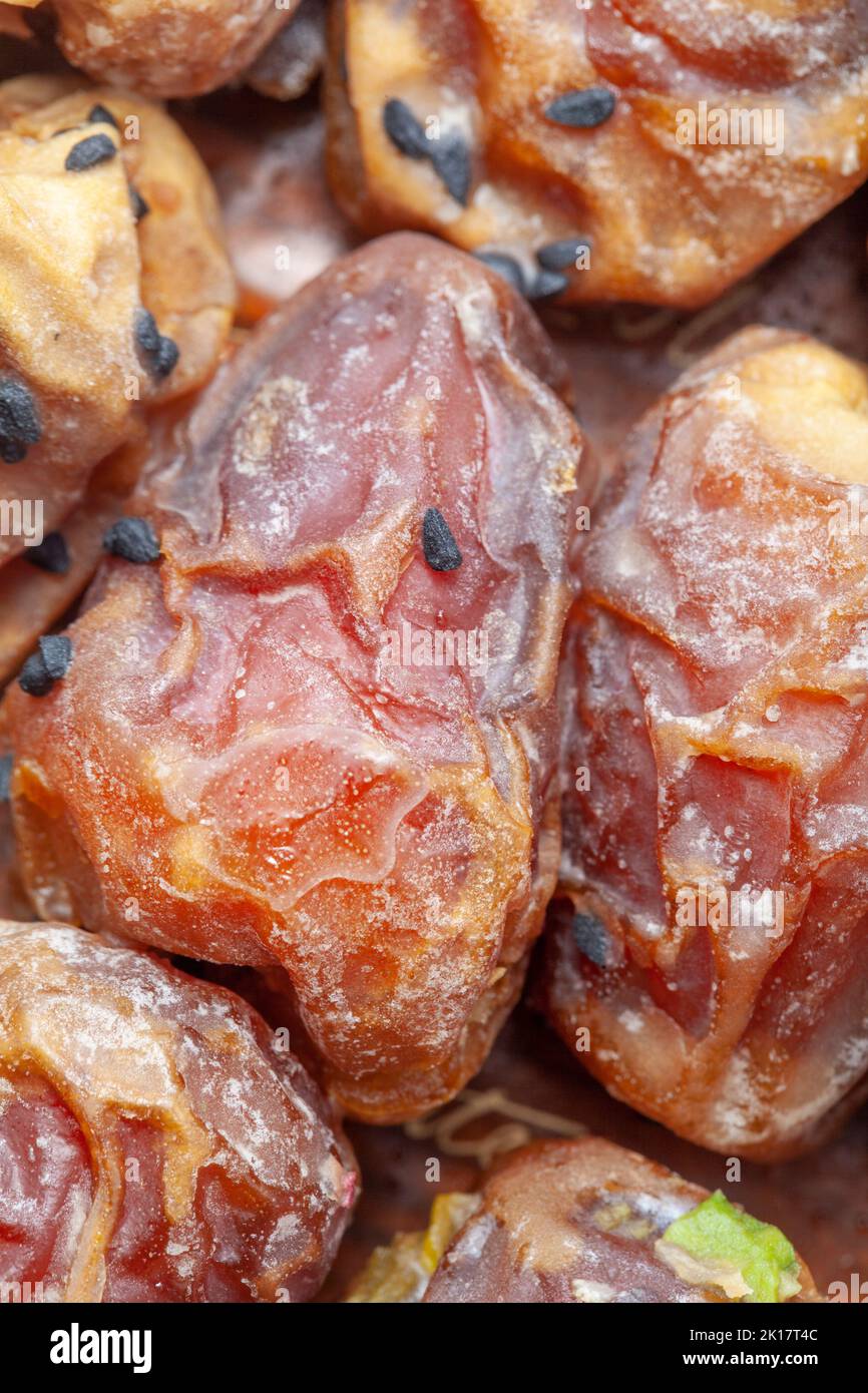 Traditional Arabic Sukari dates close up with nuts and arab herbs full ...
