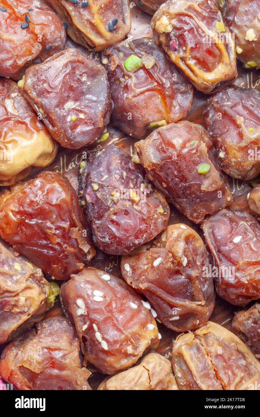 Traditional Arabic Sukari dates close up with nuts and arab herbs full ...