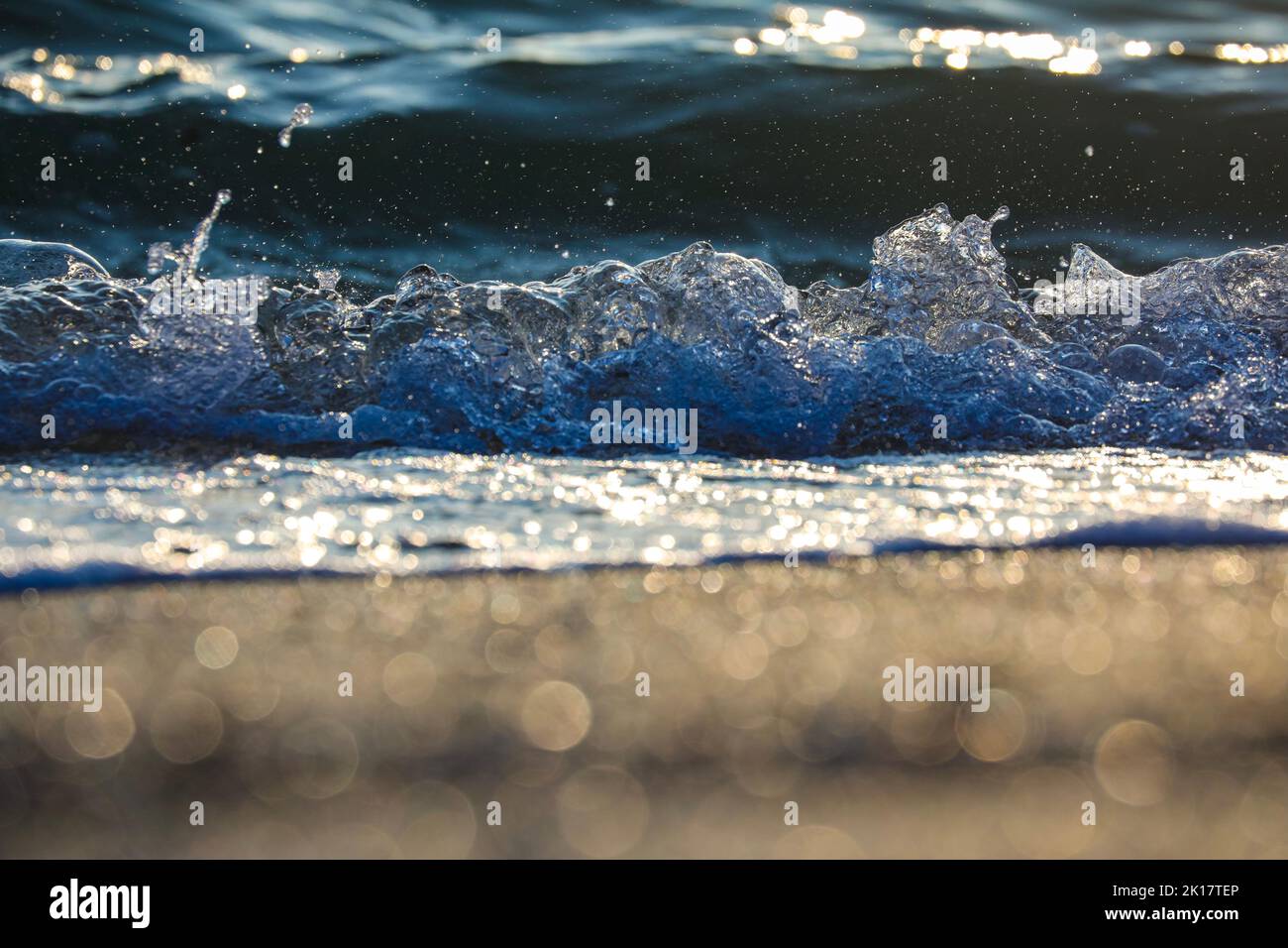 Closeup of crashing ocean wave on beach. Clam waves and soft sea surf ...