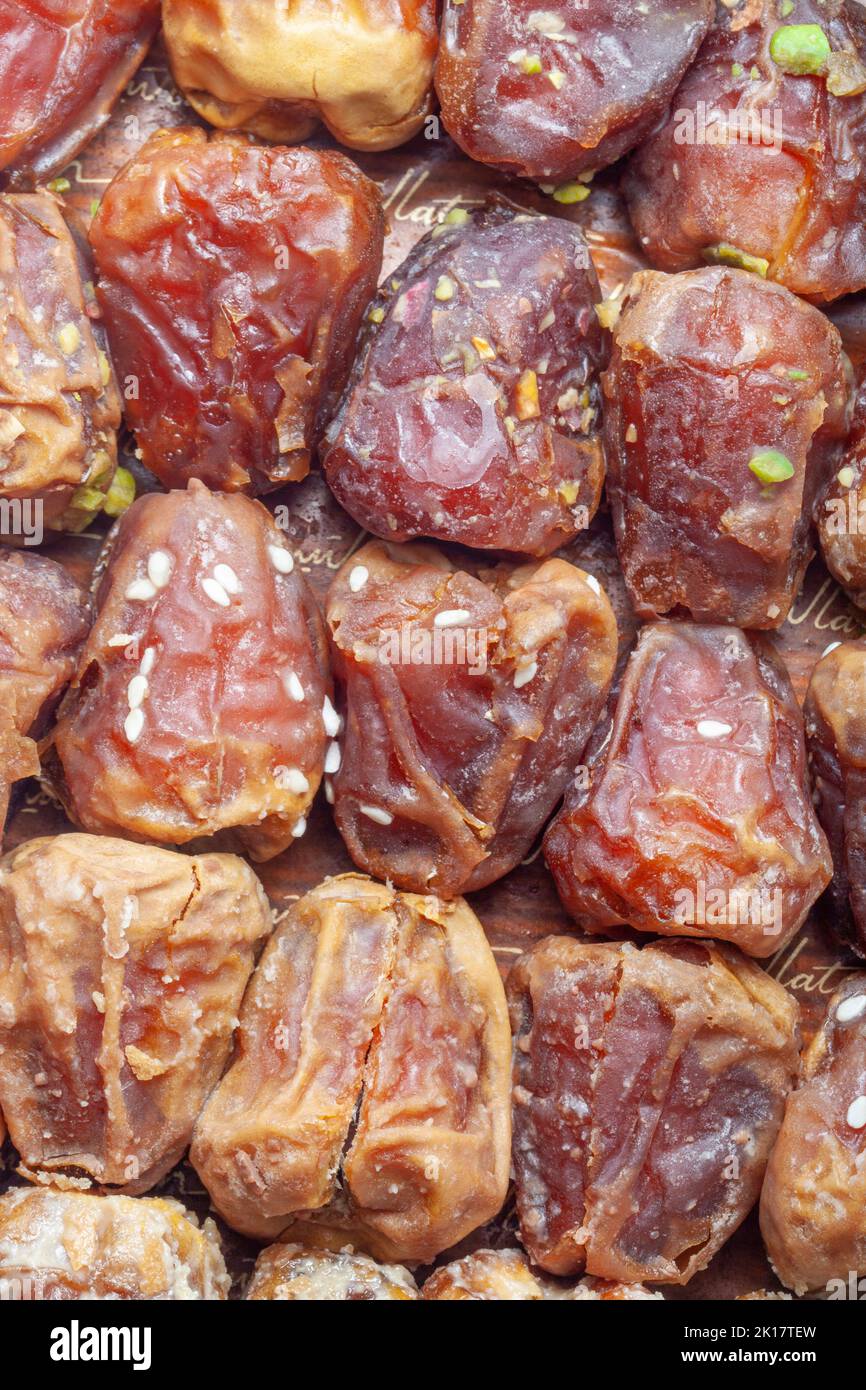 Traditional Arabic Sukari dates close up with nuts and arab herbs full ...