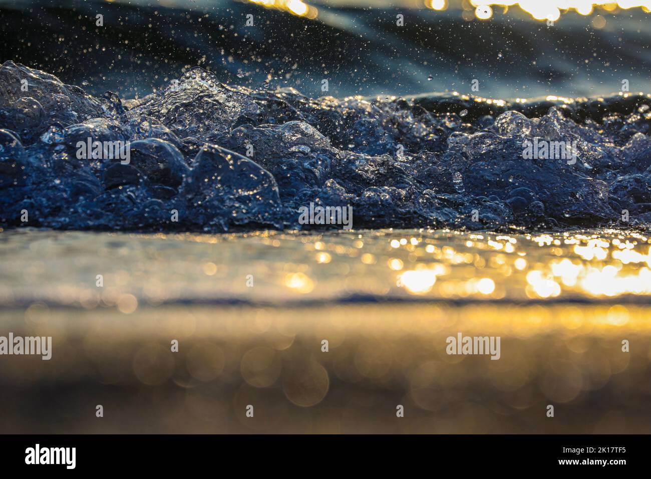 Closeup of crashing ocean wave on beach. Clam waves and soft sea surf ...