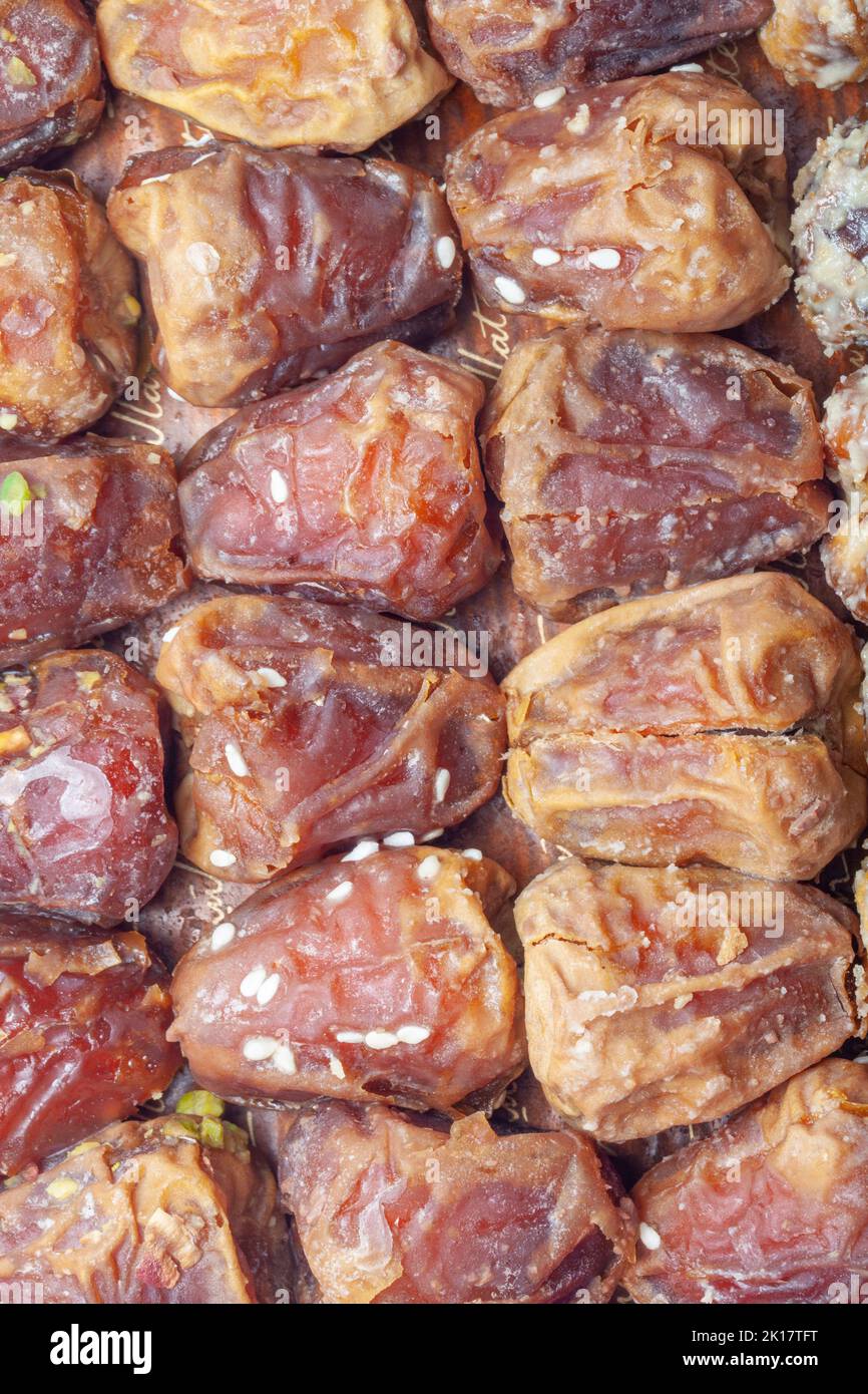Traditional Arabic Sukari dates close up with nuts and arab herbs full ...