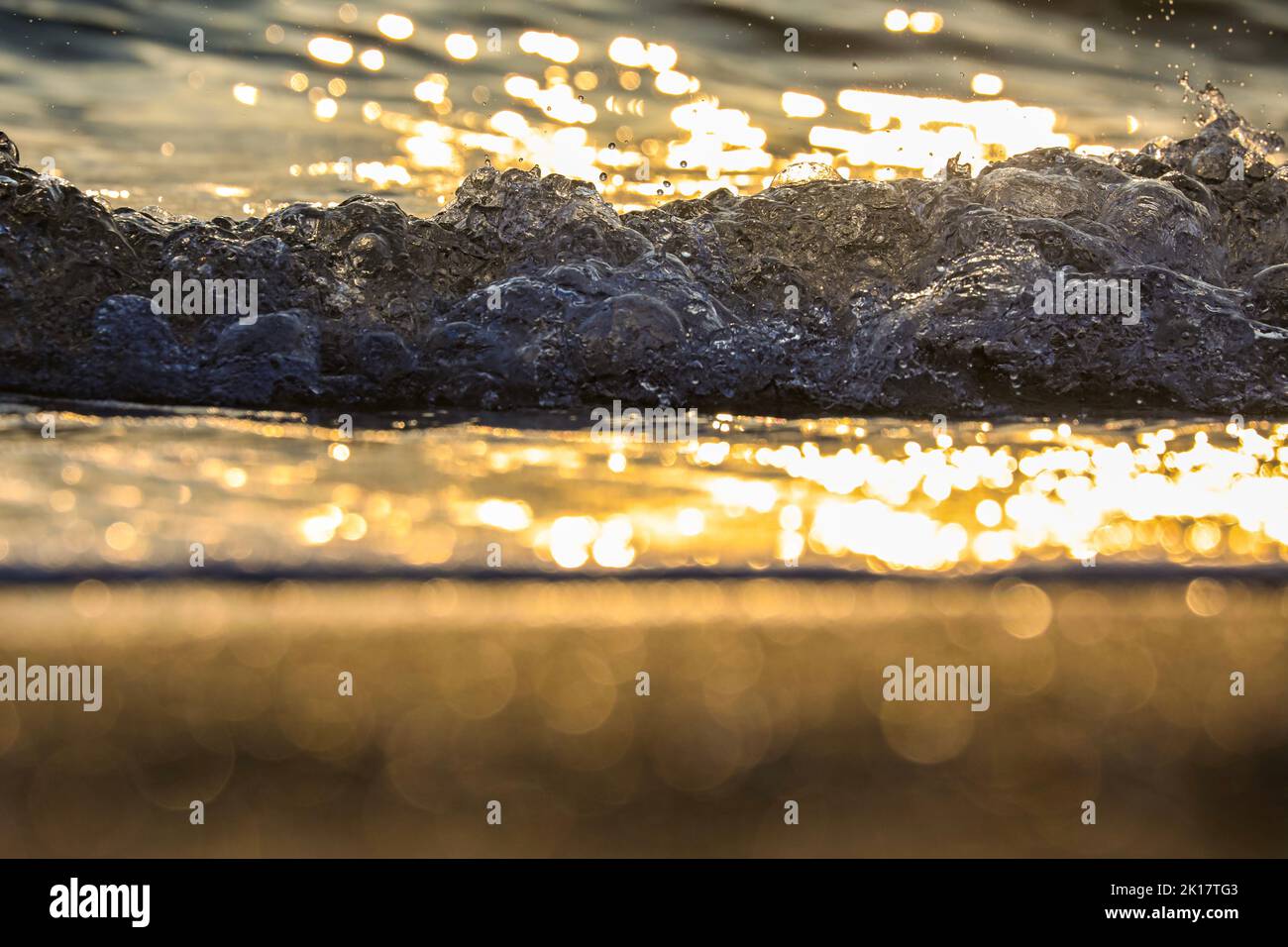 Closeup of crashing ocean wave on beach. Clam waves and soft sea surf ...