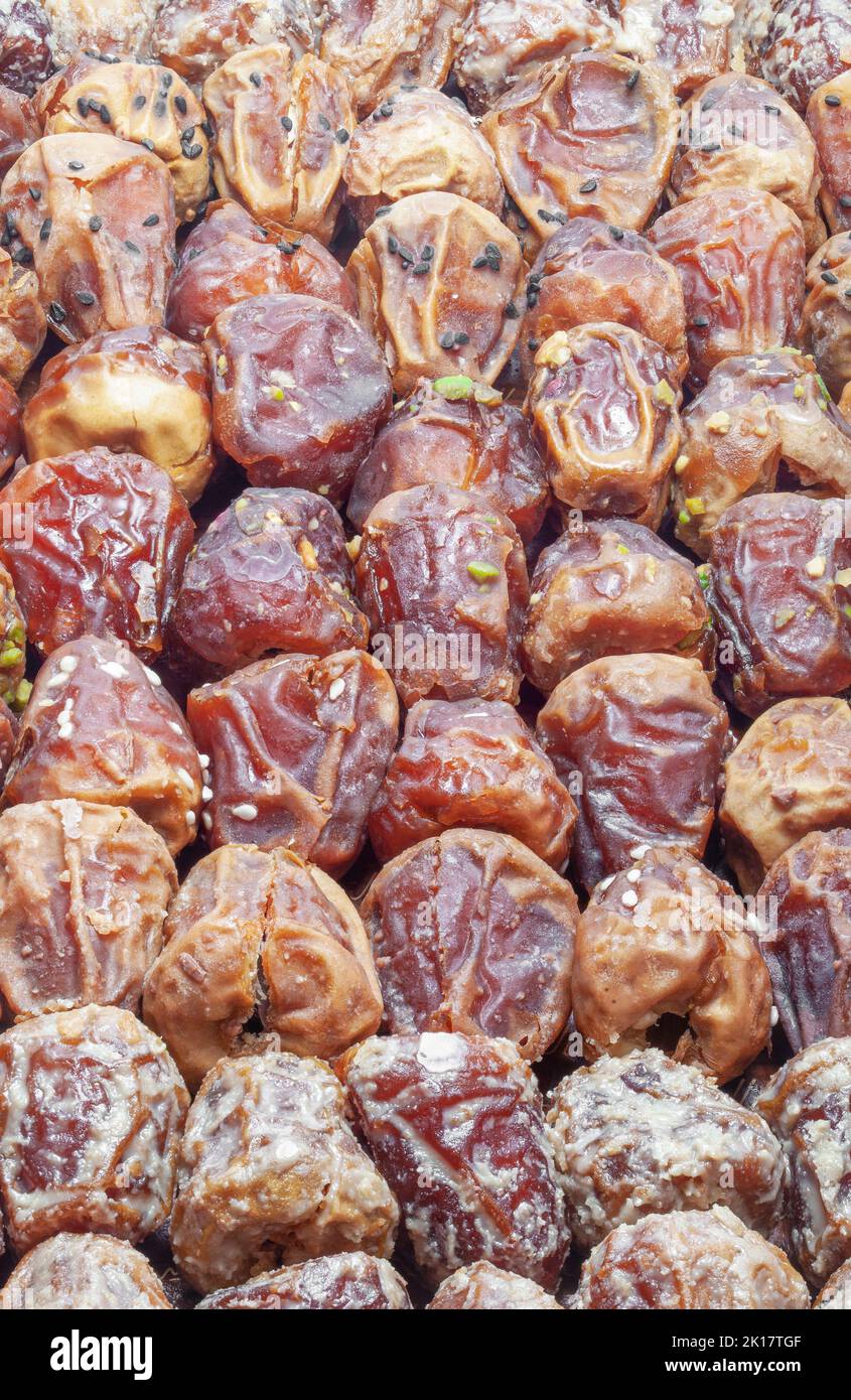 Traditional Arabic Sukari dates close up with nuts and arab herbs full ...