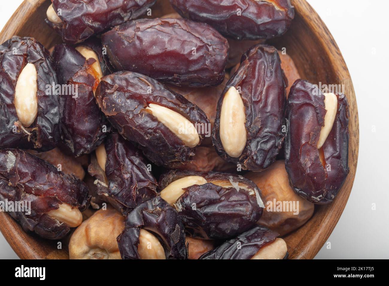 Traditional Arabic Sukari dates close up with nuts and arab herbs full ...