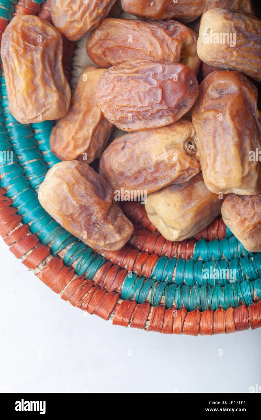 Traditional Arabic Sukari dates close up with nuts and arab herbs full ...