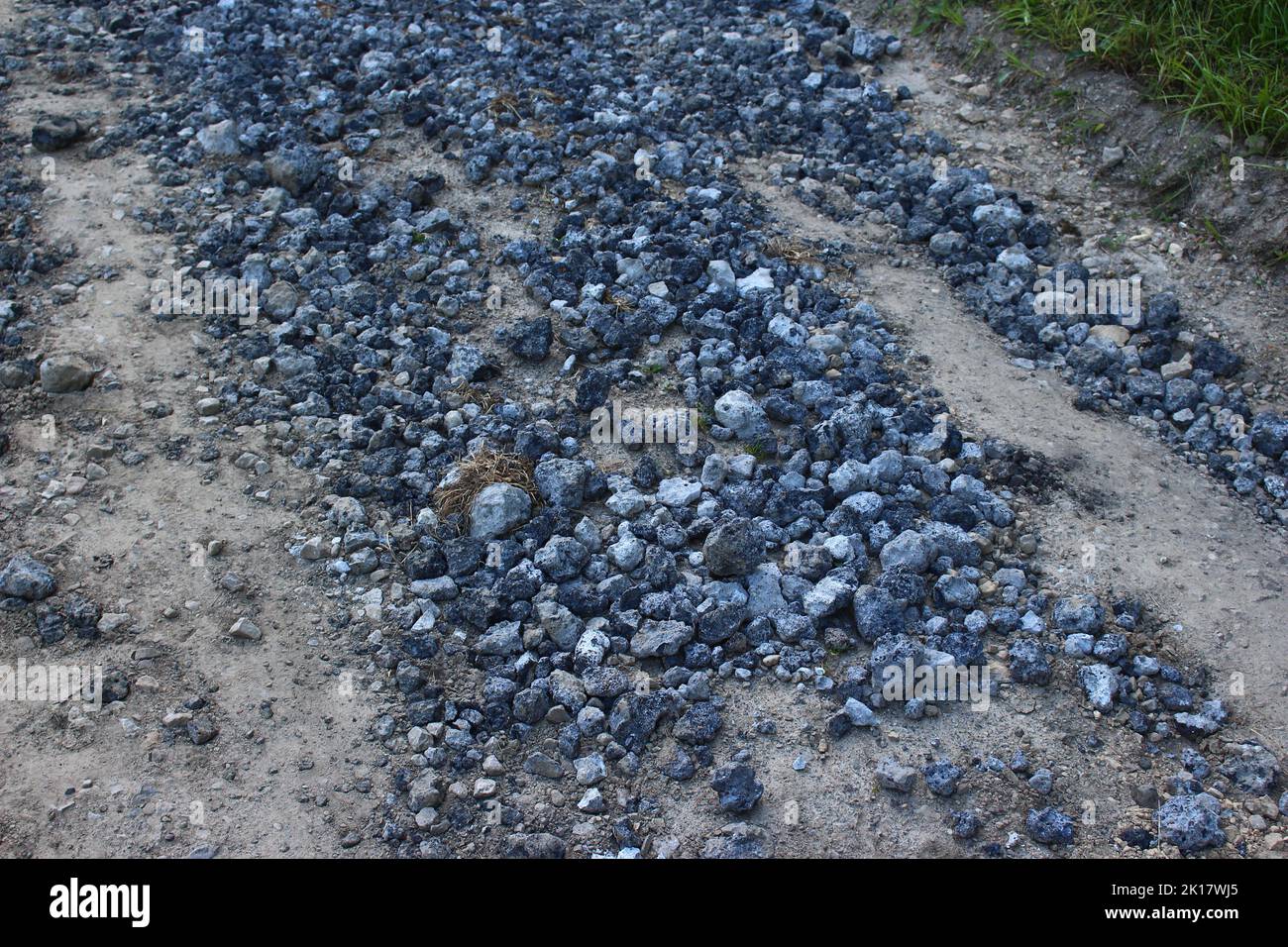 Country road filled with slag from metallurgical production Stock Photo ...
