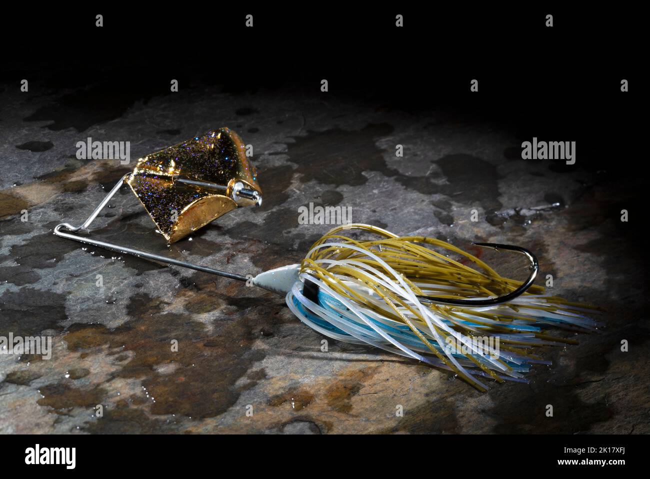 Wet gold bladed buzz bait with room for copy at the right Stock Photo ...