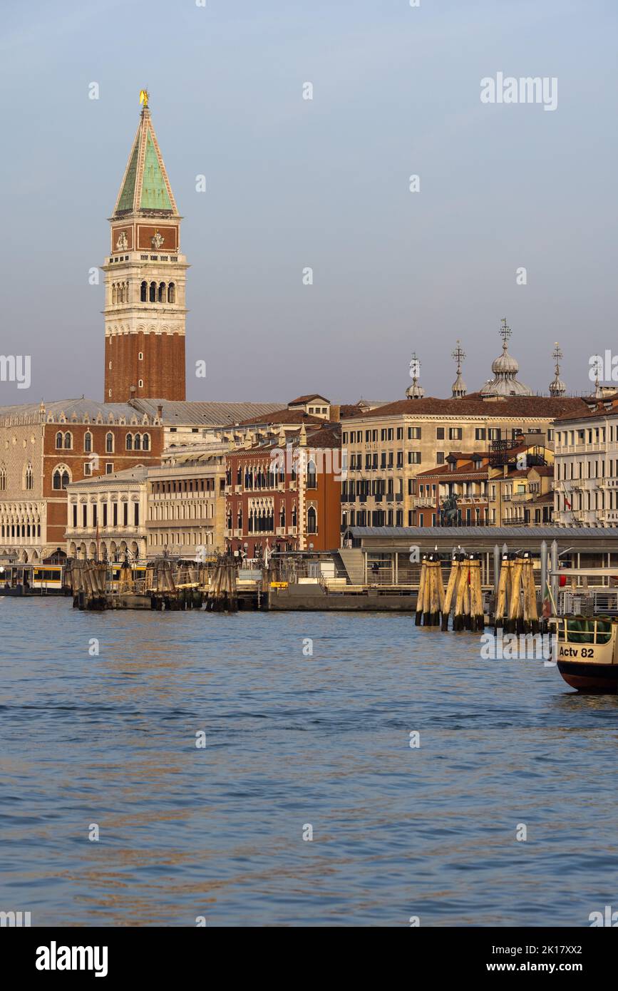 Big canal in Venice with boats and San Marco square on sunny day with ...