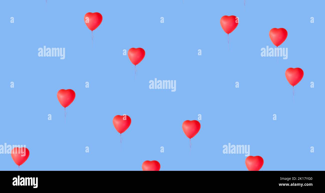 Image of multiple digital red heart shaped balloons love icons floating ...