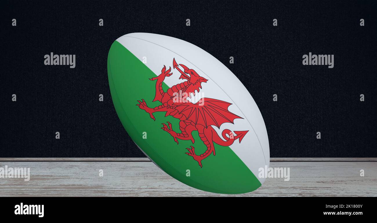 Composition of rugby ball decorated with the flag of wales on black ...