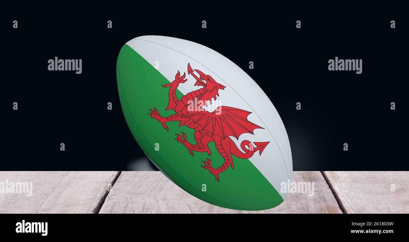 Composition of rugby ball decorated with the flag of wales on black ...
