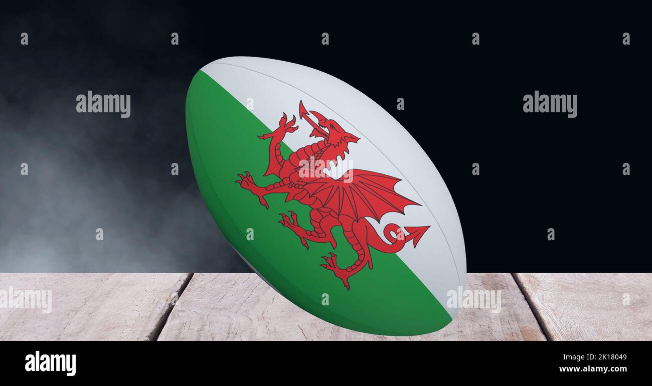 Composition of rugby ball decorated with the flag of wales on black ...