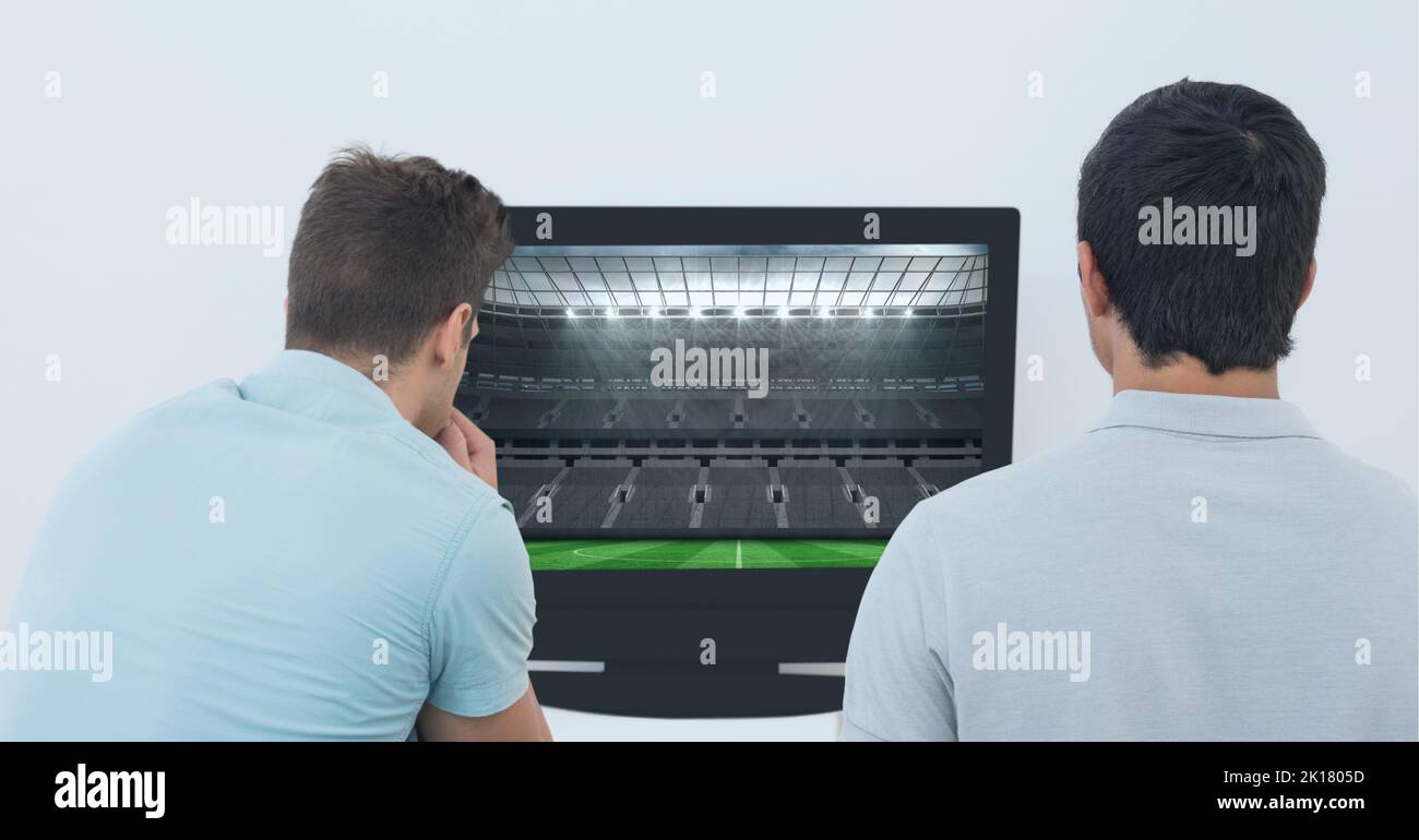 Composition of two male sports fans watching sports stadium on tv ...