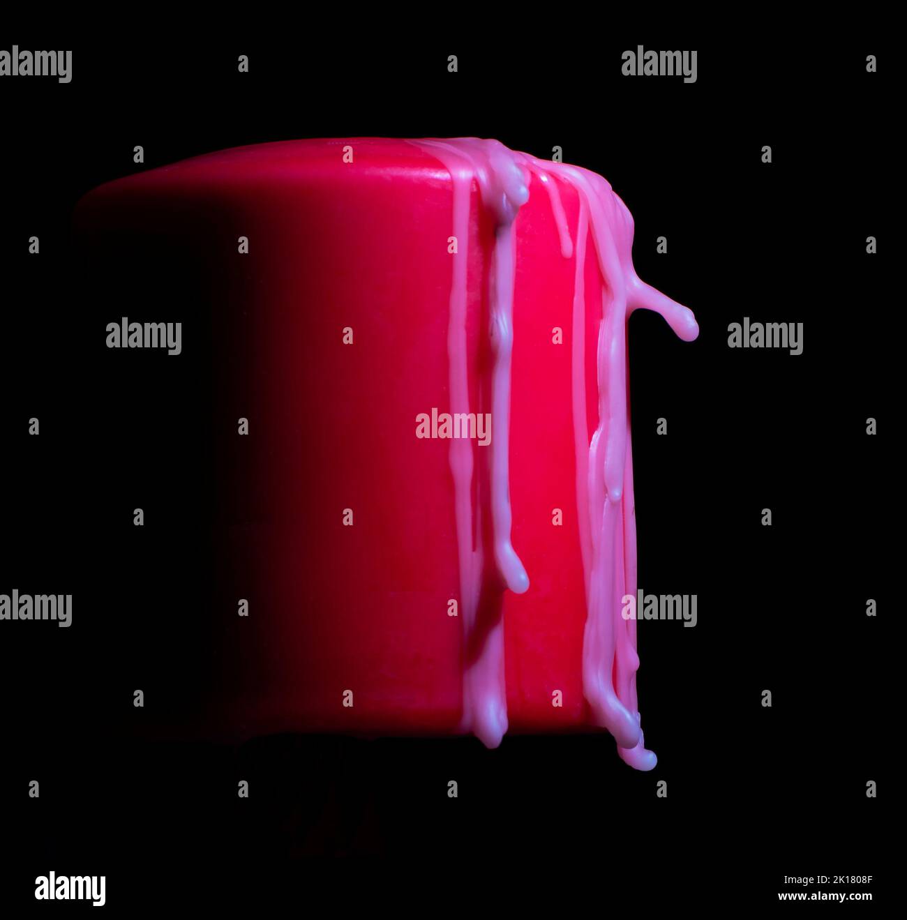 Wax frozen on the side of a red candle on a black background Stock ...