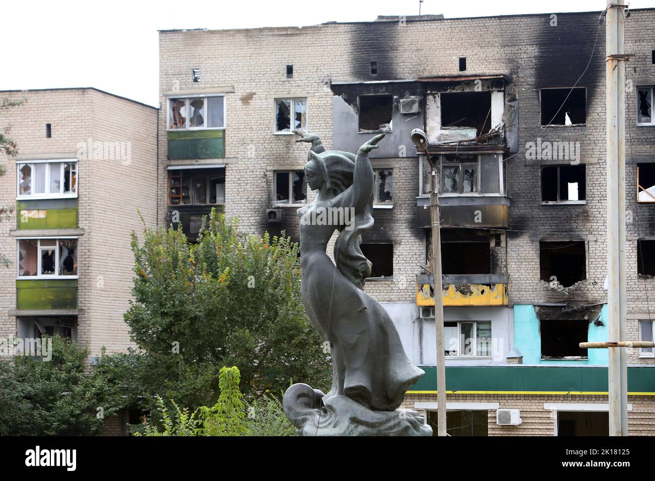 IZIUM, UKRAINE - SEPTEMBER 15, 2022 - A statue is seen before an ...