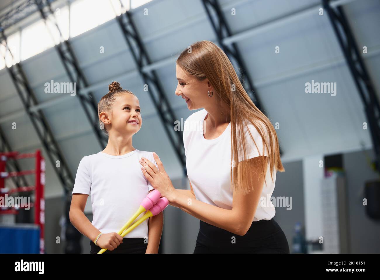 Coaching and support. Sport coach compliments beginner gymnastics ...