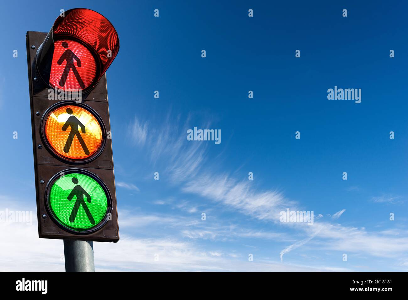 Closeup of a traffic light. Pedestrian traffic sign against a clear ...