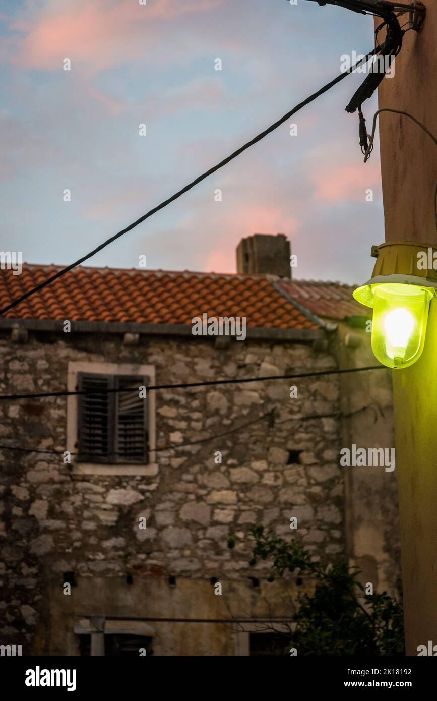 Street light on a stone house, Veli Iz, Island of Iz, Zadar archipelago ...