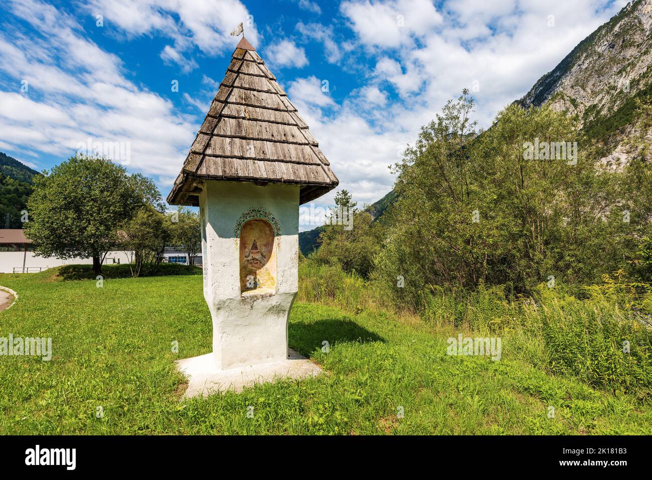 Small and ancient Votive Shrine with wooden roof. Small village of ...