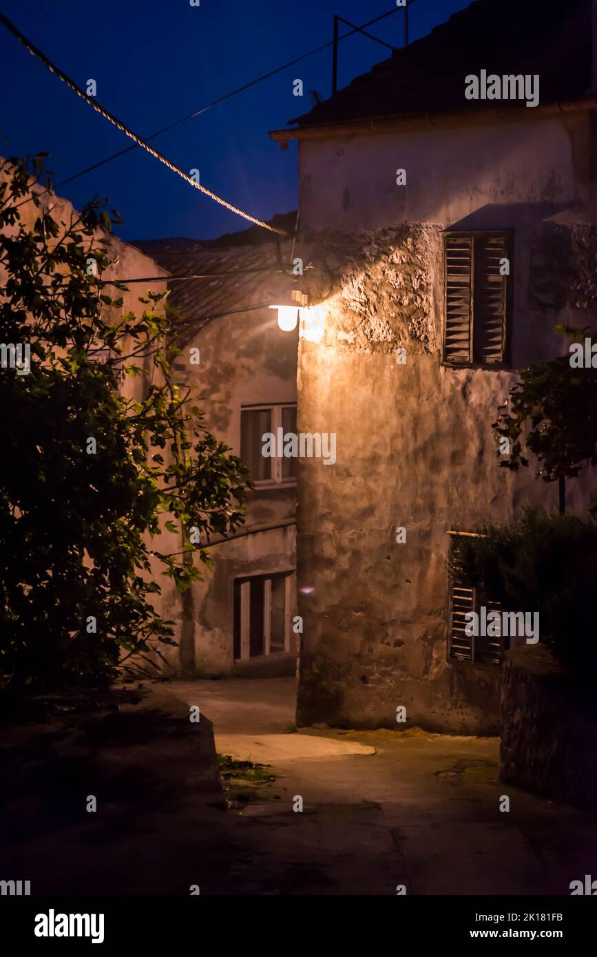 Empty, narrow street at night, Veli Iz, Island of Iz, Zadar archipelago ...