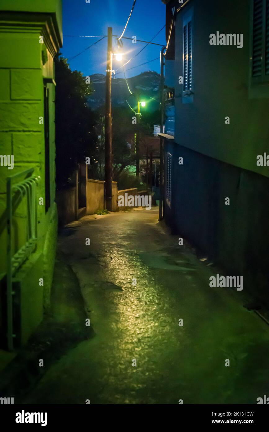Empty, narrow street at night, Veli Iz, Island of Iz, Zadar archipelago ...