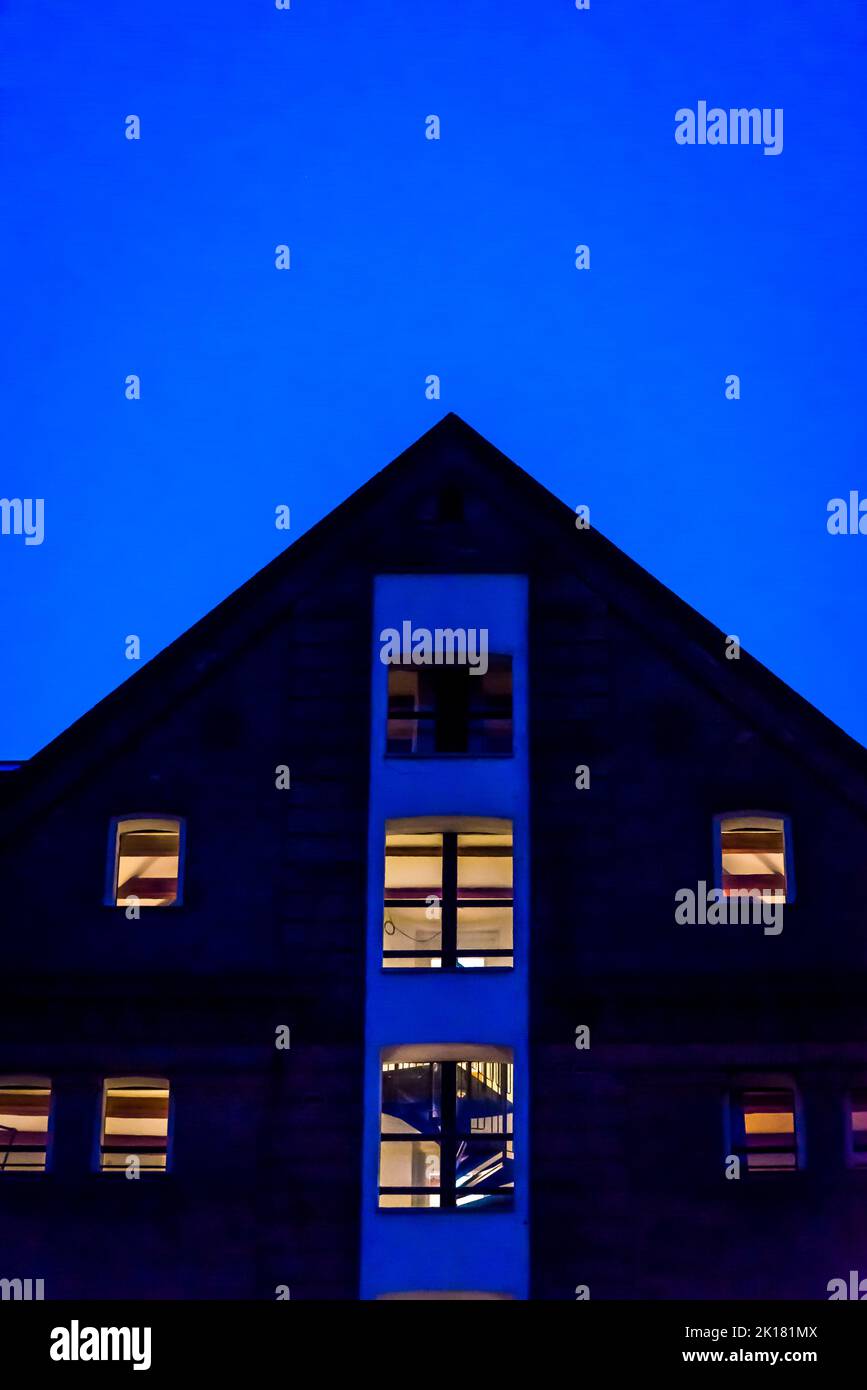 House with lit windows at night, Copenhagen, Denmark Stock Photo - Alamy