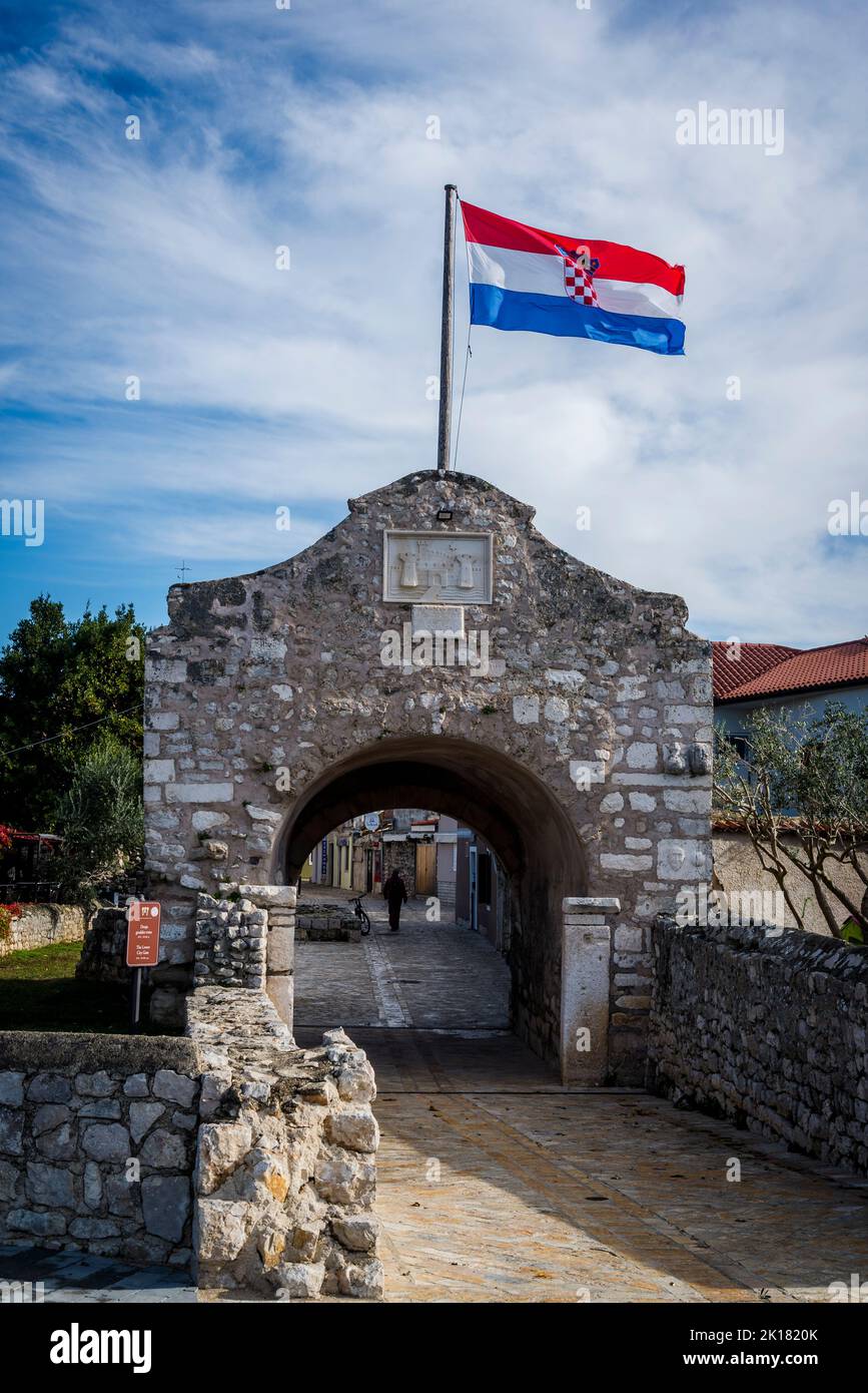 Croatian flag on the lower city gate to the Old Town of Nin, a town in ...