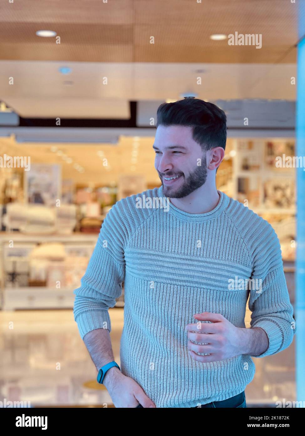 Person wearing blue sweater hi-res stock photography and images - Alamy