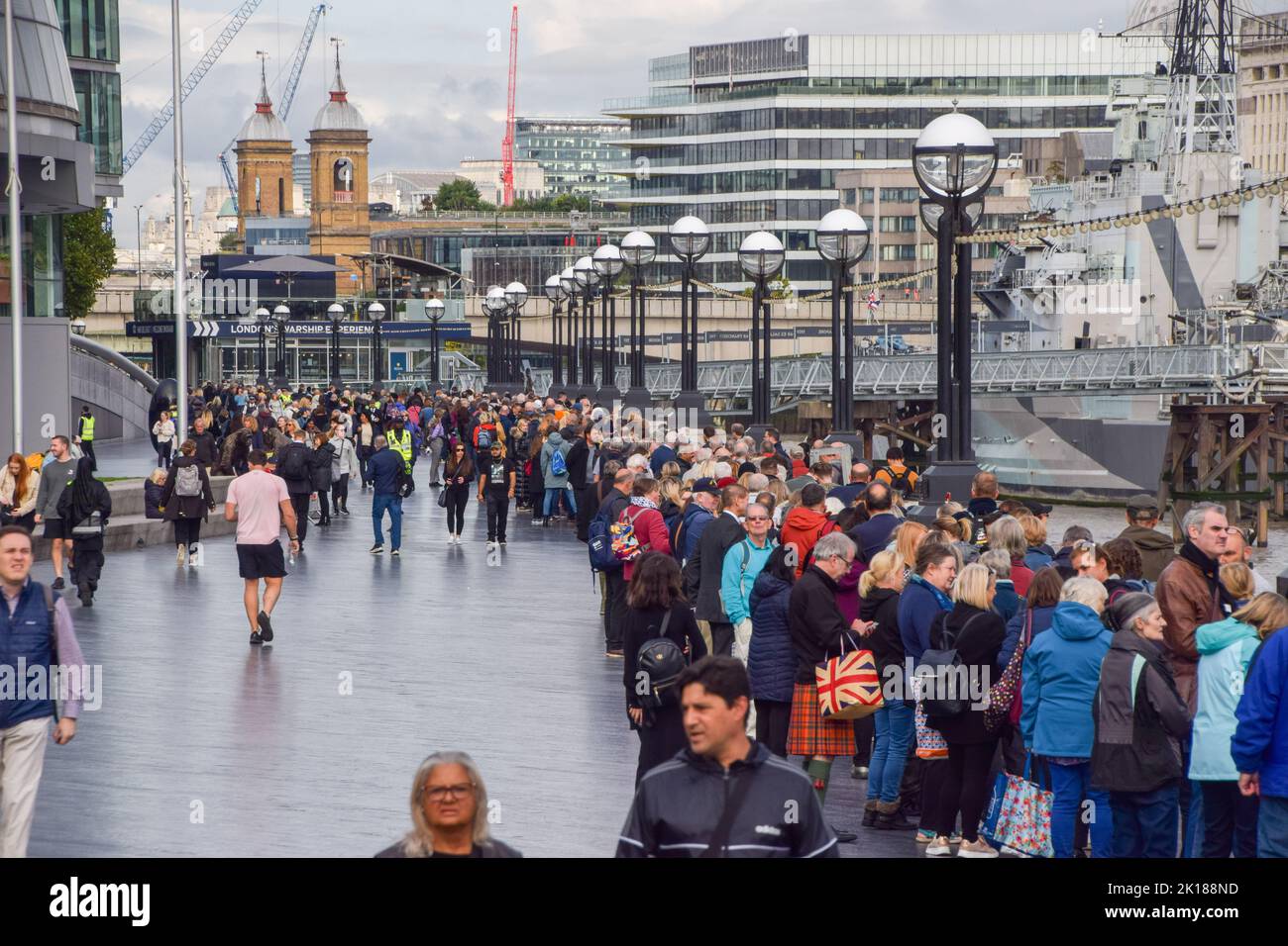London, UK. 16th Sep, 2022. Huge crowds wait next to Tower Bridge. The ...