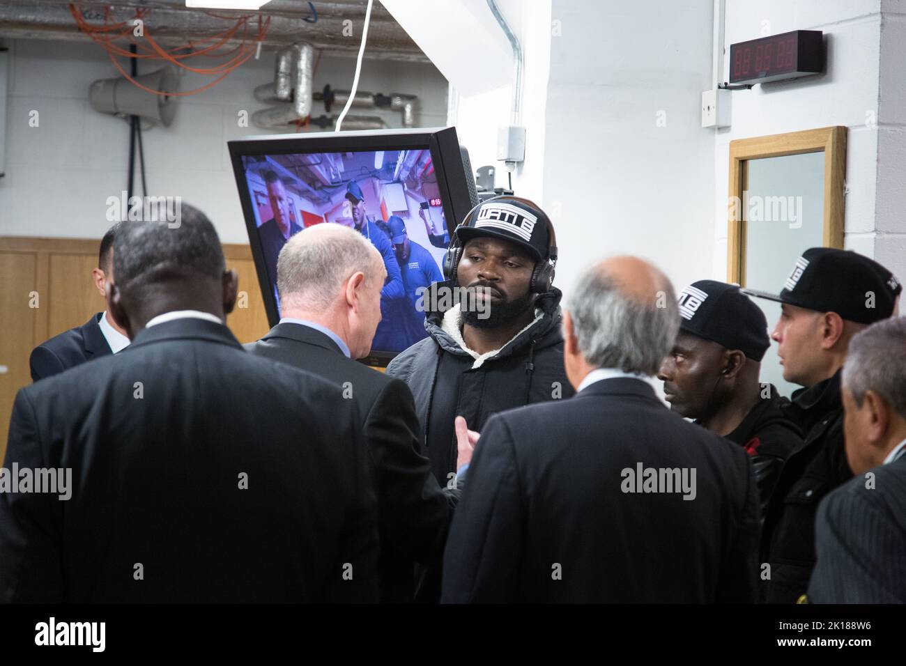 Carlos Takam talks to the match referee in the dressing room before his ...