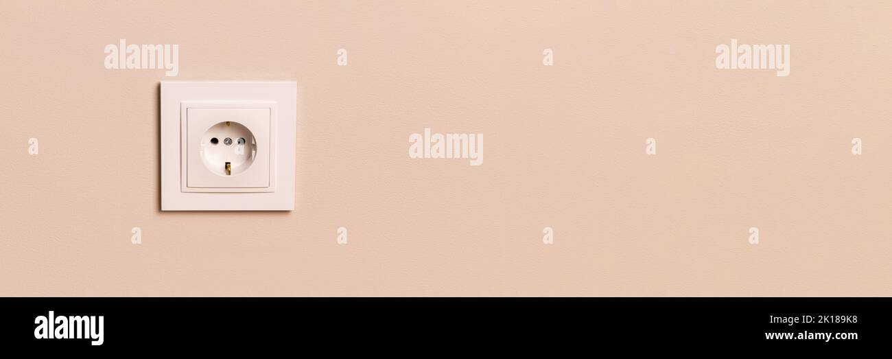 White european electrical outlet on modern beige wall with copy space ...
