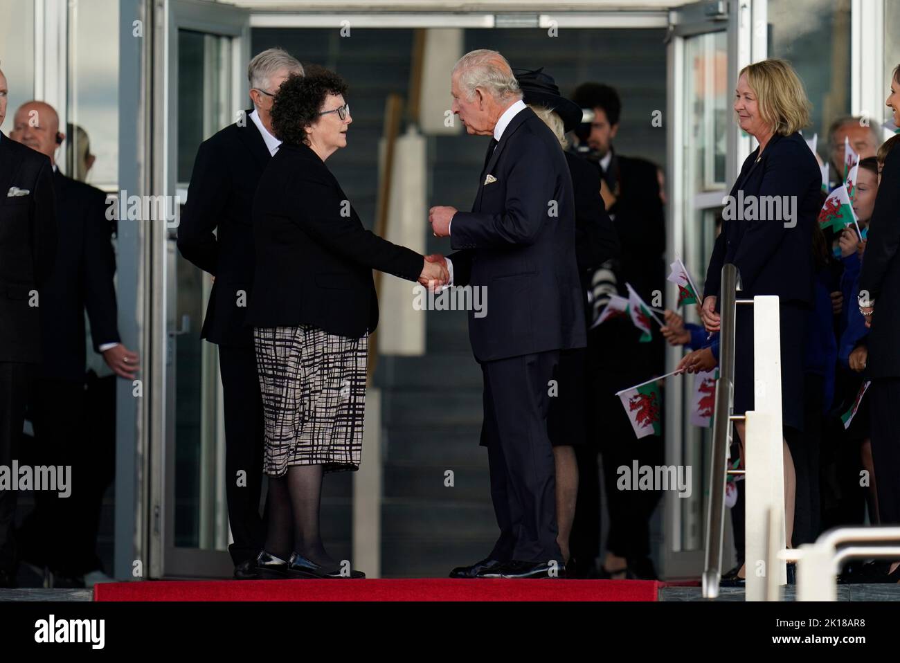 King Charles III shakes the hand of Llywydd (presiding officer) Elin ...