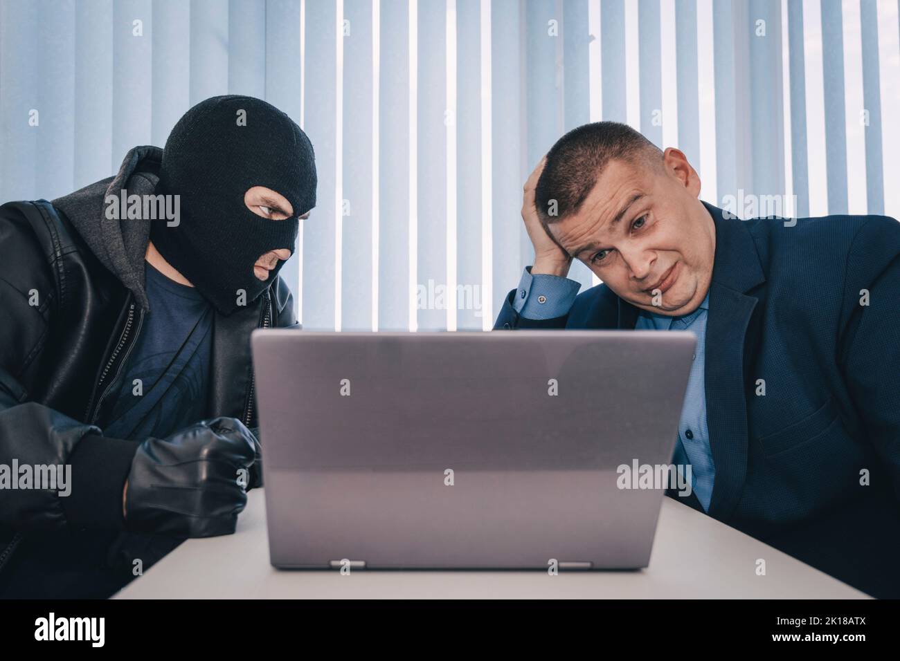 The extortionist thief demands money in the businessman's office. Theft ...